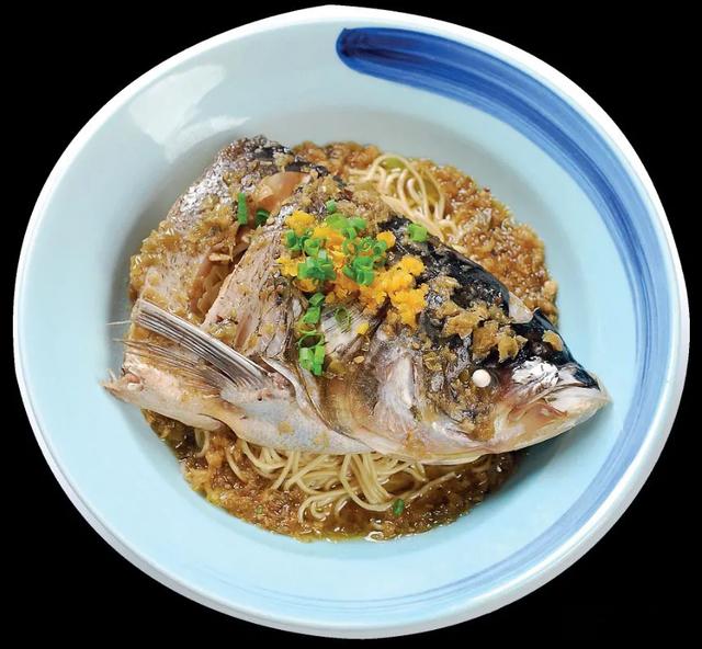 This fish head noodle tastes sour and spicy, the fish is tender and has ...